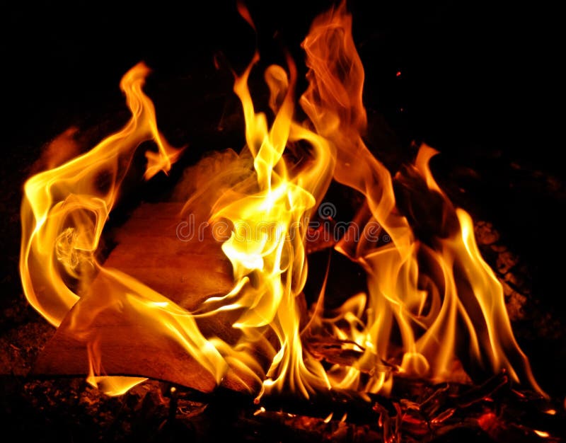 Flaming wood fire at night stock image. Image of combustion - 8799291