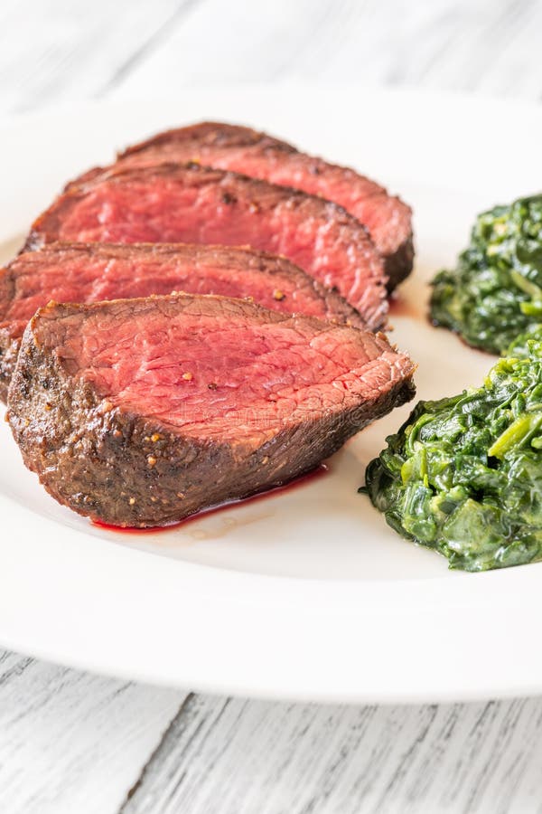 Flank Steak with Creamy Spinach Stock Image - Image of juicy, rare ...