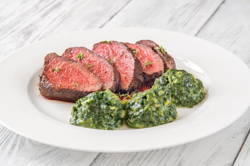 Flank Steak with Creamy Spinach Stock Image - Image of cream, cooked ...