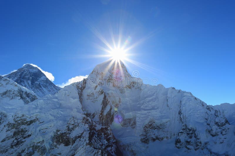 Flare Over Nuptse Summit beside of Everest Stock Image - Image of ...