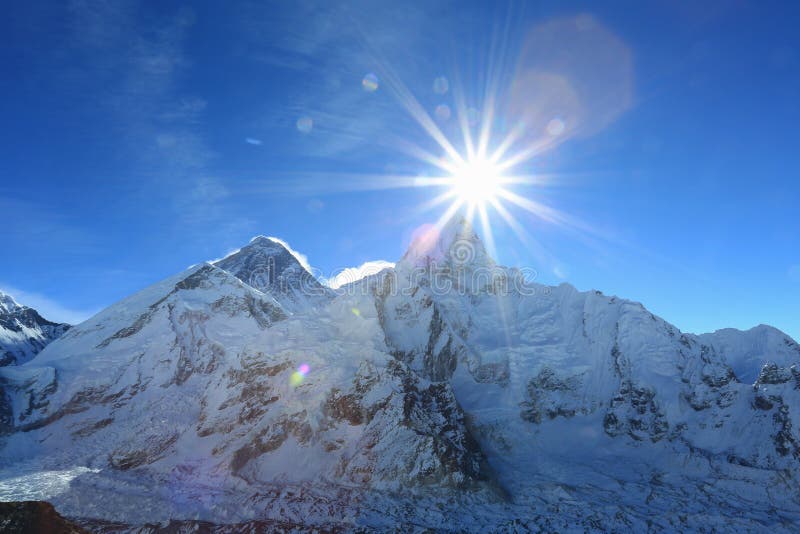 Flare Over Nuptse Summit beside of Everest Stock Photo - Image of great ...
