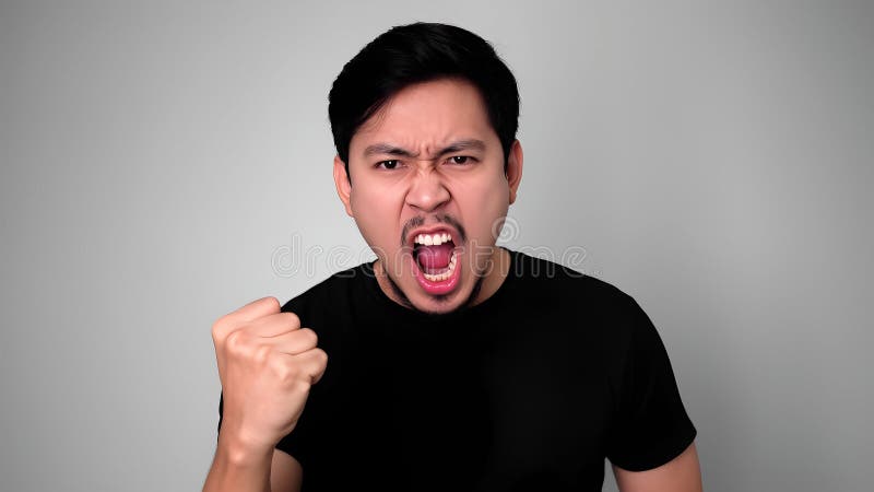 A Flash of Anger - a Man Shouts with Tense Features, His Hands Clenched ...