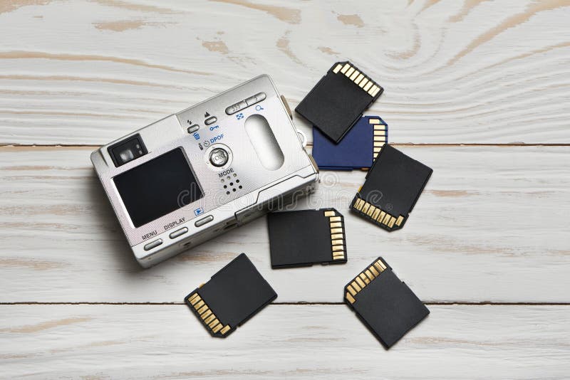Flash Cards SD and Compact Digital Camera on Wooden Stock Photo - Image ...