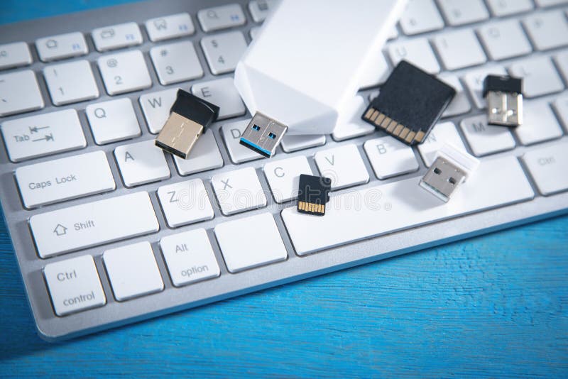 Flash Drive and Memory Cards on the Computer Keyboard Stock Photo ...