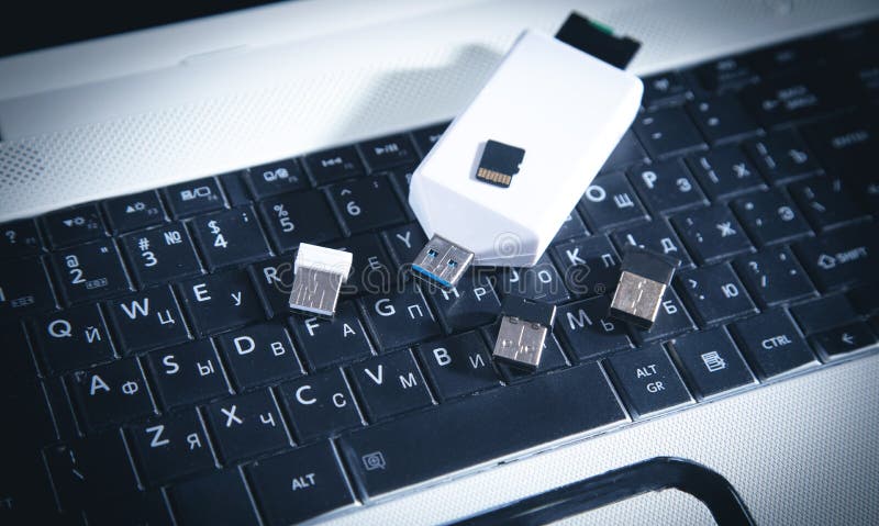 Flash Drive and Memory Cards on the Computer Keyboard Stock Photo ...