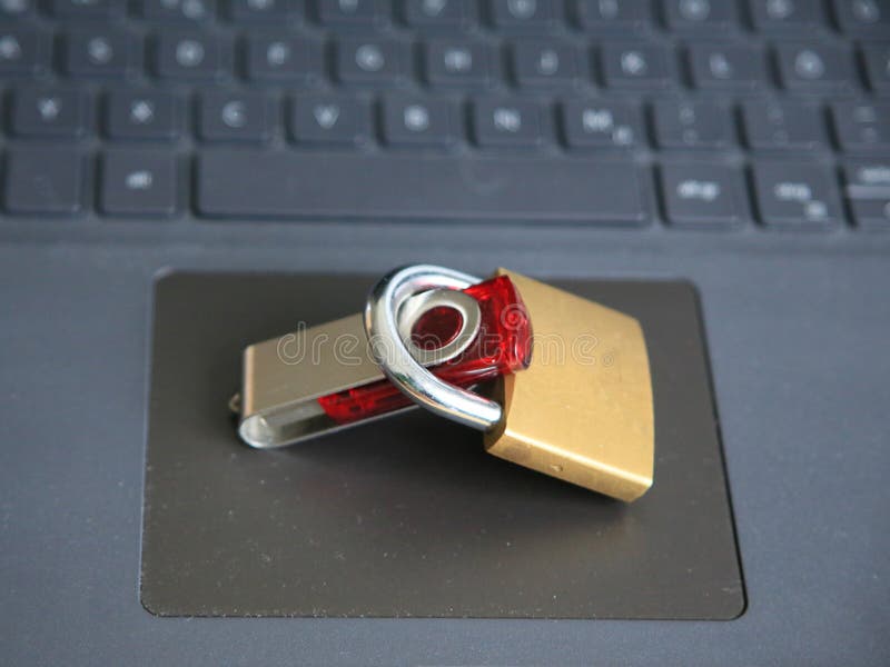Flash Drive and Padlock on the Laptop; Information Leak Prevention ...
