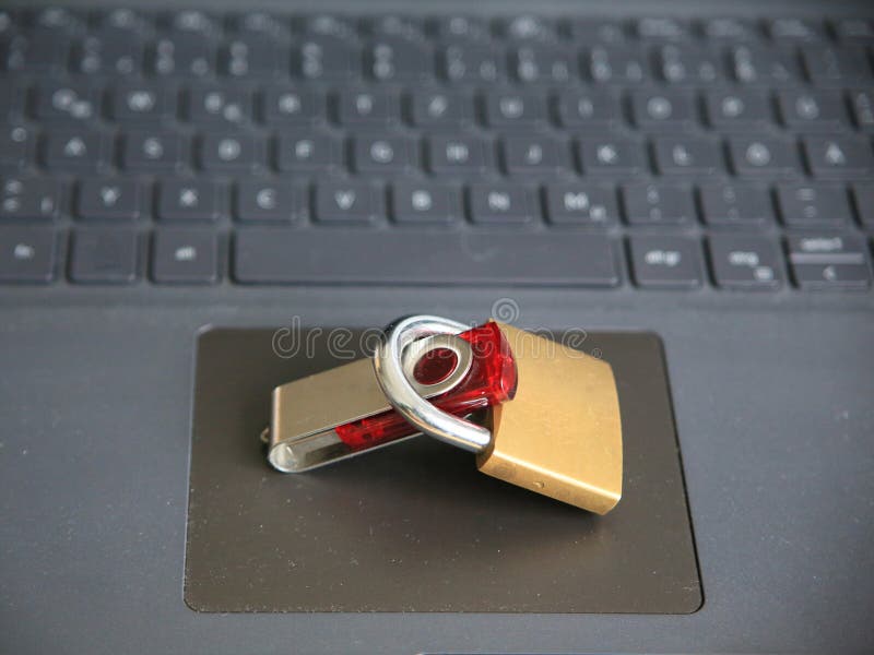 Flash Drive and Padlock on the Laptop; Information Security Concept ...