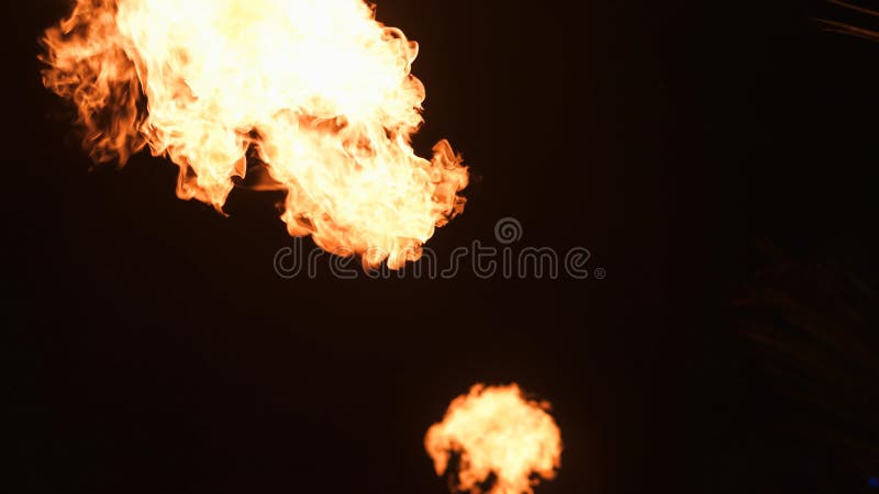 Flashes of Fire Against a Black Background during a Fire Show Stock ...