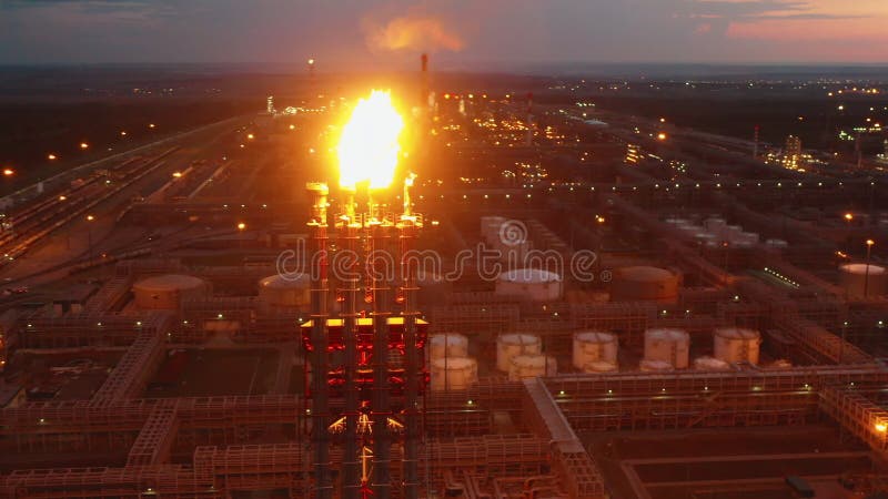 Flashes of Fire are Getting Emitted by Flare Stacks at Night Stock ...