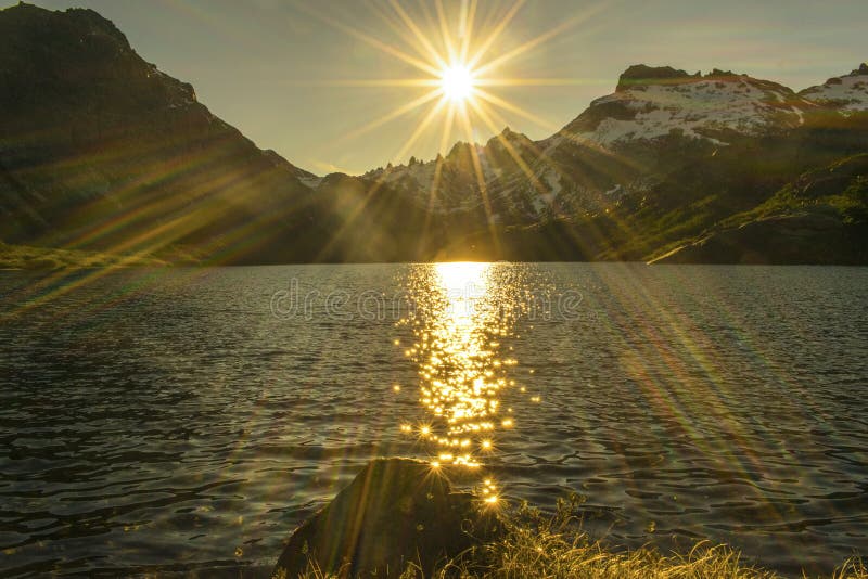 Flashes of sun over a lake stock image. Image of blue - 138460741