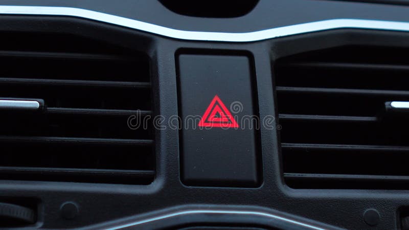 Flashing Emergency Warning Light on the Dashboard in a Car with ...