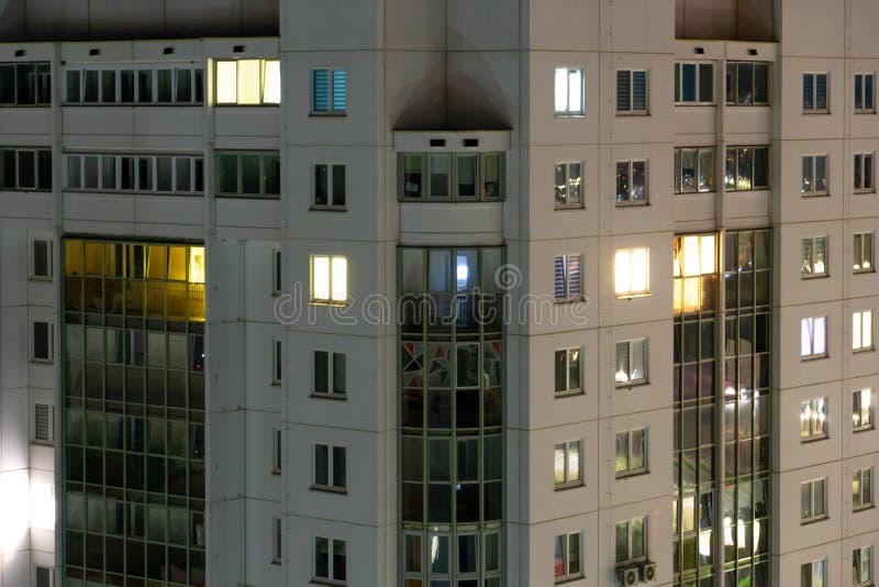 Flashing Lights in the Windows of a Large Apartment Building. Burning ...