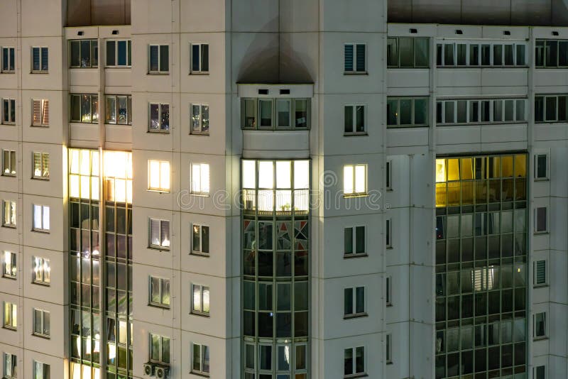 Flashing Lights in the Windows of a Large Apartment Building. Burning ...