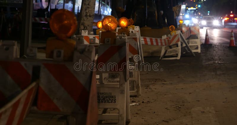 Flashing Yellow Light on Caution Signs in a Construction Zone at Night ...
