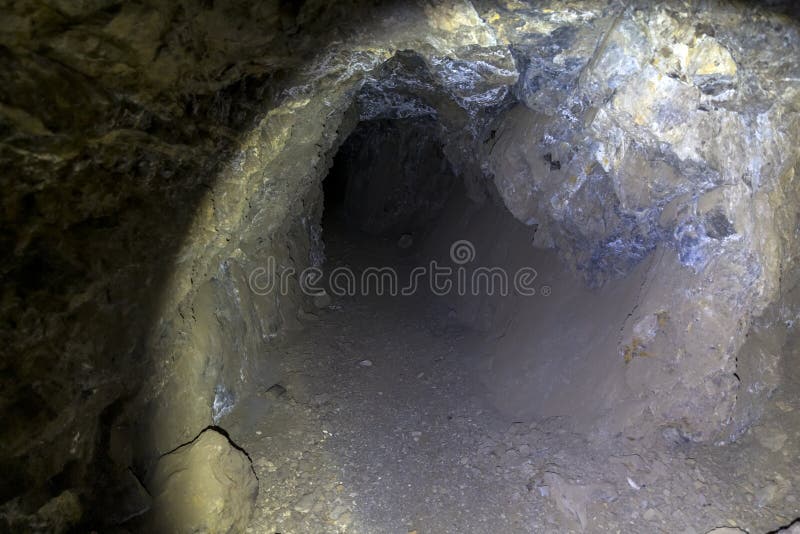 Flashlight Beam Illuminates the Shaft of an Underground Tunnel Stock ...