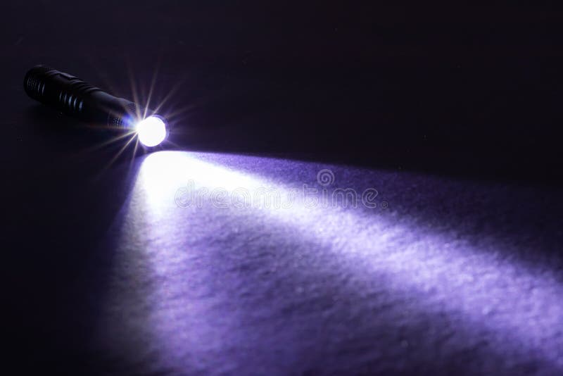 Flashlight and a Beam of Light in Darkness. a Modern Led Lamp with ...