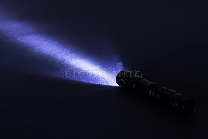 Flashlight and a Beam of Light in Darkness. a Modern Led Lamp with ...