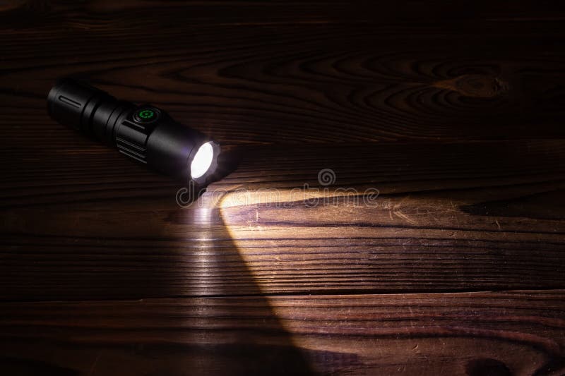 Flashlight and a Beam of Light in Darkness. a Modern Led Lamp with ...