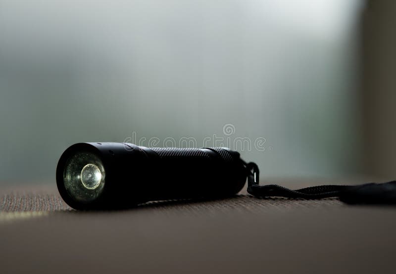 Flashlight on a Bench Turned on Stock Image - Image of turned, steel ...