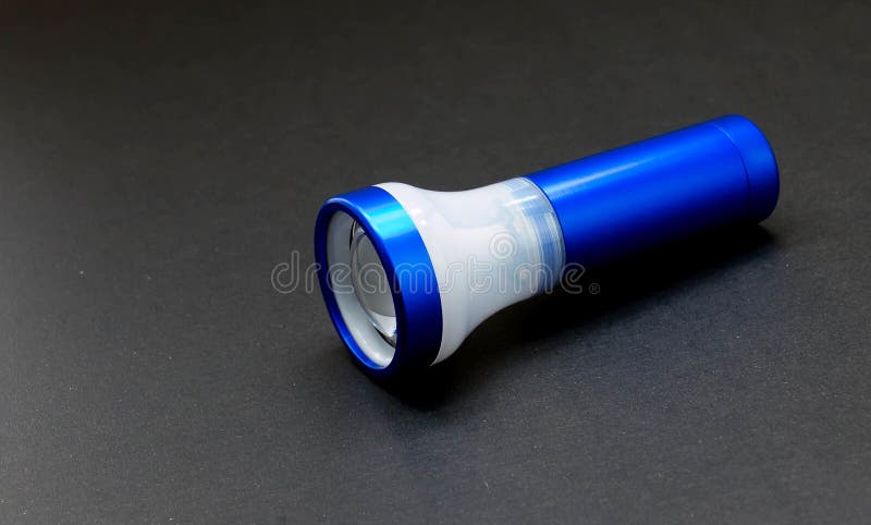 Flashlight on black table stock image. Image of dark - 67581621