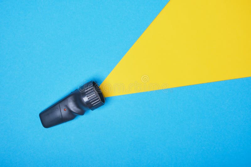 Flashlight on a Blue Background with a Yellow Ray of Light, Made from ...