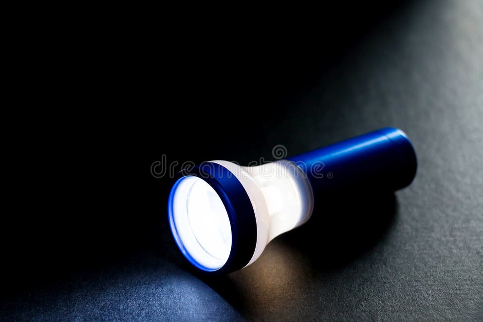 Flashlight in the dark stock photo. Image of flashlight - 67581572