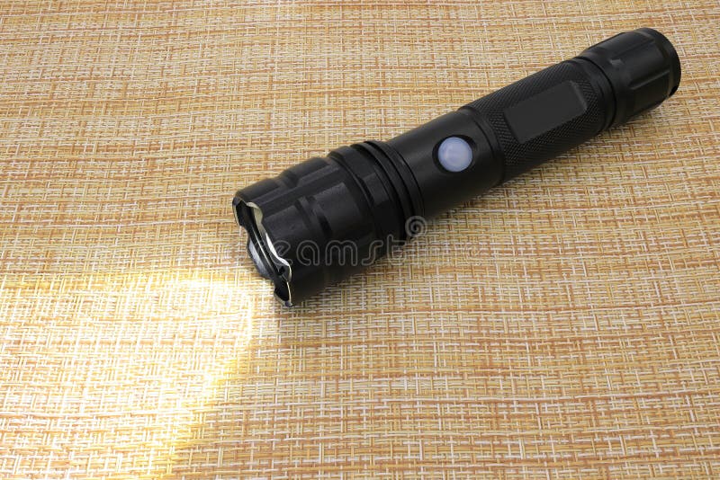 The Flashlight is on in the Dark Room on the Table Stock Image - Image ...
