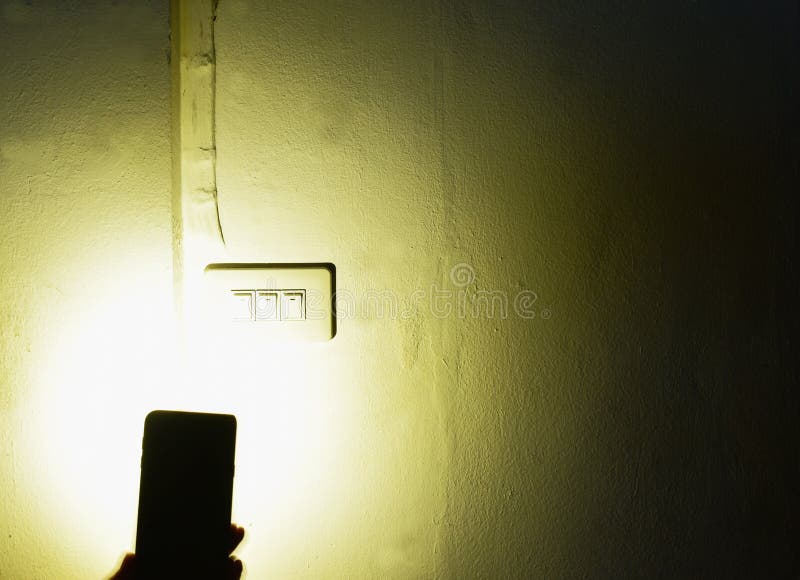Flashlight of Mobile Phone Spreading Light To Electric Switch on Home ...