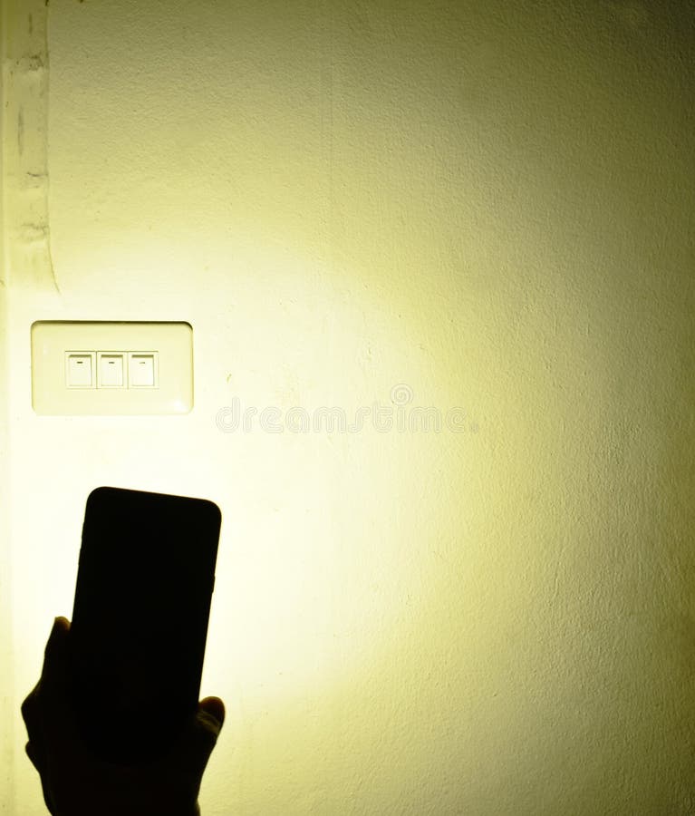 Flashlight of Mobile Phone Spreading Light To Electric Switch on Home ...