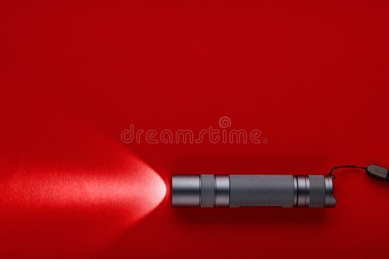 Flashlight on a Red Background. a Beam of Light from a Flashlight Stock ...