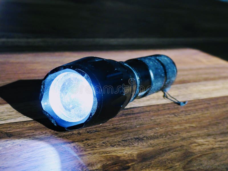 Shining flashlight stock image. Image of bright, black - 13682129