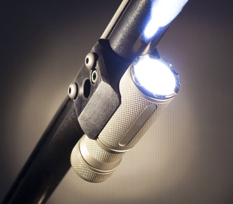 Flashlight on Under a Shotgun Barrel Stock Image - Image of bronze ...