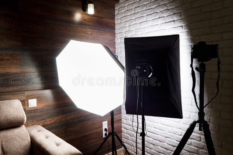 Flashlights with Softboxes and a Camera on a Tripod in the Living Room ...