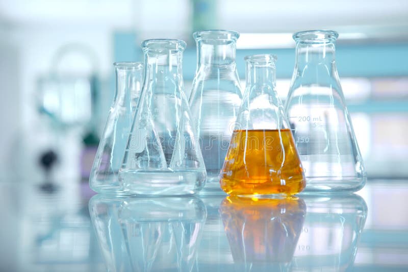 Orange Liquid in Glass Flask with Cylinder Vial in Chemical Science ...