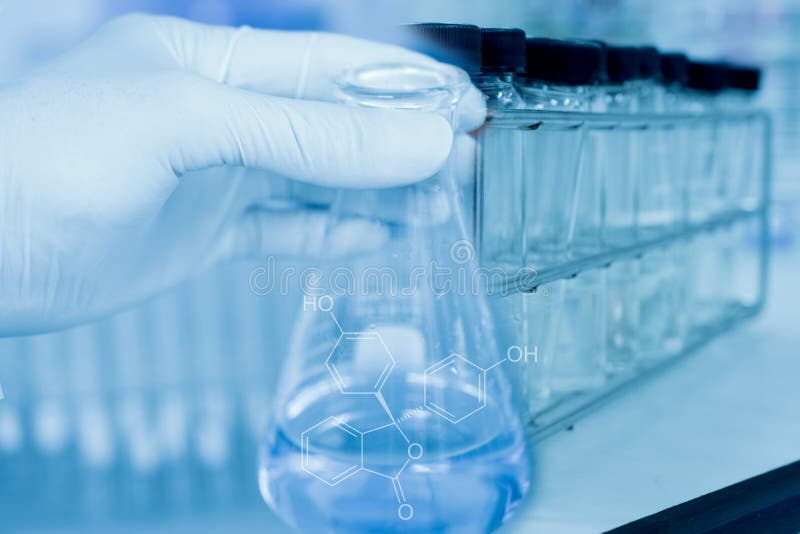 Flask in Scientist Hand with Test Tubes Stock Image - Image of hand ...