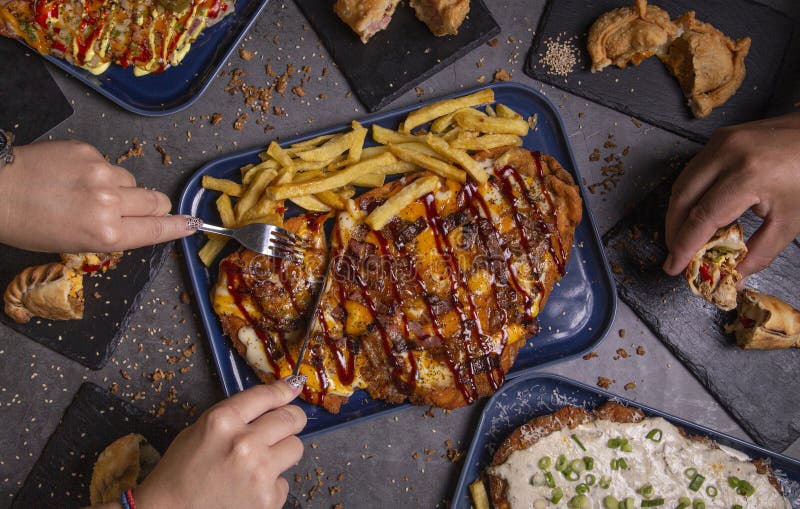 Flat Bar Meals with Empanadas and Hands Stock Photo - Image of hand ...