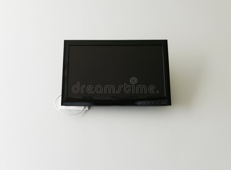Flat Black LED TV Mounted on a White Wall Stock Photo - Image of movie ...