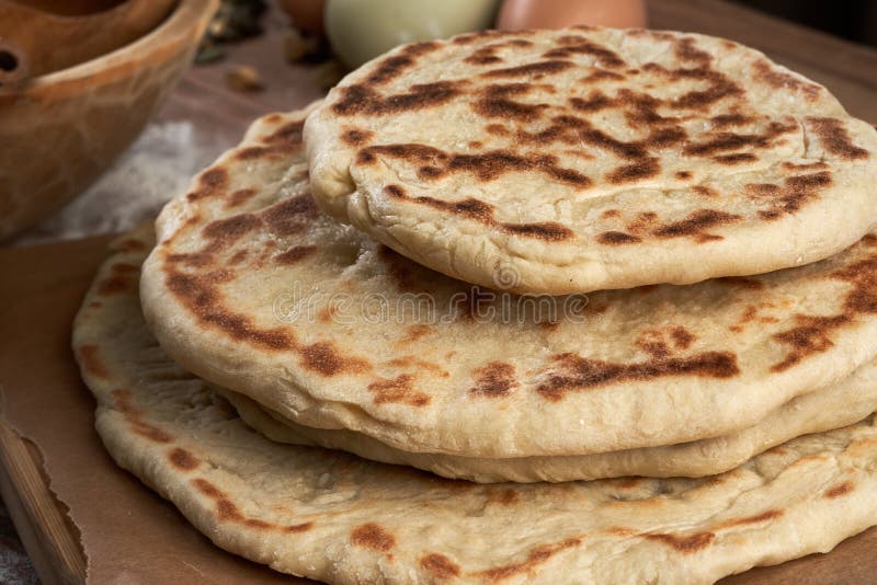 Flat bread with seeds stock image. Image of closeup - 213343131