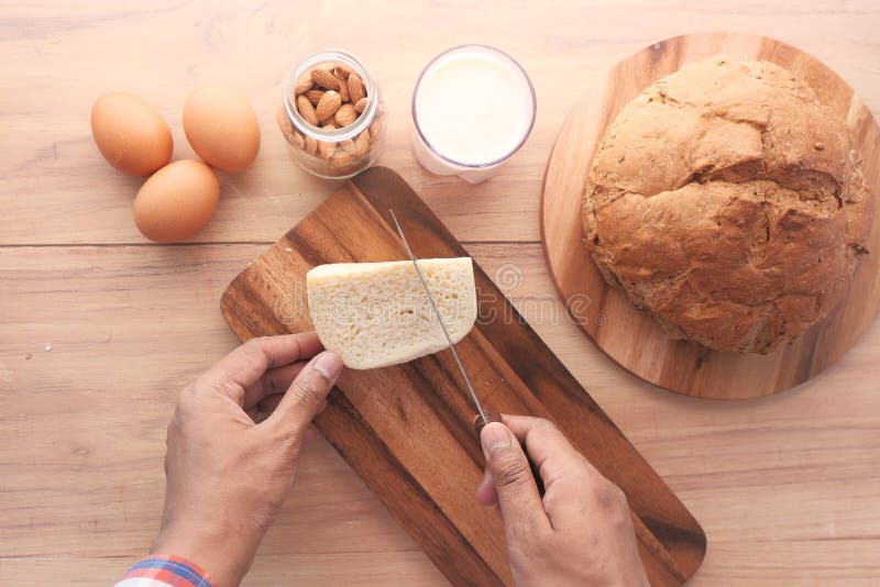 Flat Composition of of Man Hand Cutting Cheese on Chopping Board Stock ...