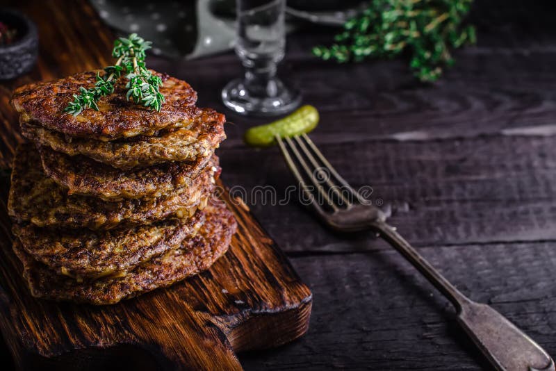 Flat Cutlets on Chopping Board. Dark Wooden Background Stock Image ...
