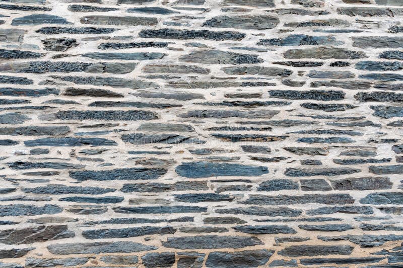 Stone Wall Constructed with Flat Rocks, Visible Mortar Joints Creating ...