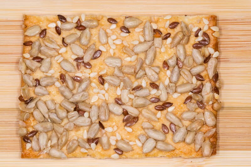 Flat Flaky Cookie with Different Seeds on a Wooden Surface Stock Image ...
