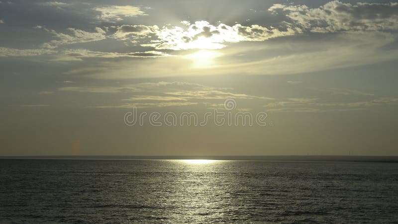 A Flat Horizon between the Sky and the Sea at Sunset on a Clear Day ...