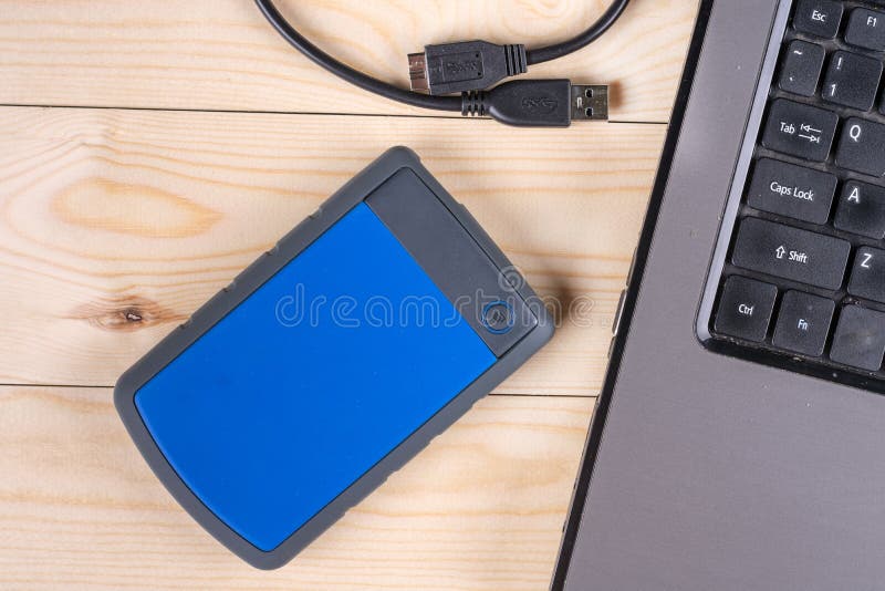 Flat Lay Above External Hard Disc by Lap Top Computer on the Wooden ...