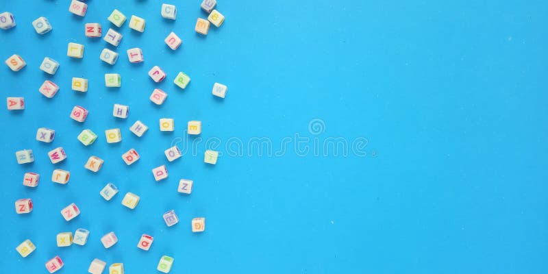 Flat Lay, Blue Background and Alphabet Plastic Cube Bead Element Design ...