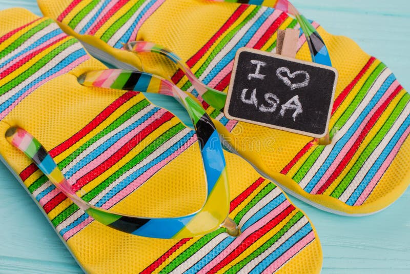 Flat Lay Bright Sandals with Chalkboard on Blue Desk. Stock Image ...