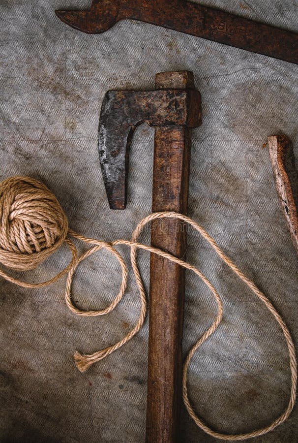 Flat-lay Collection of Vintage Tools Including an Axe, a Spanner and a ...