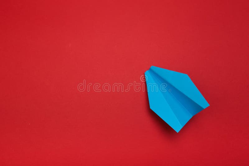 Flat Lay of Colour Paper Plane on Red Background with Text Space Stock ...