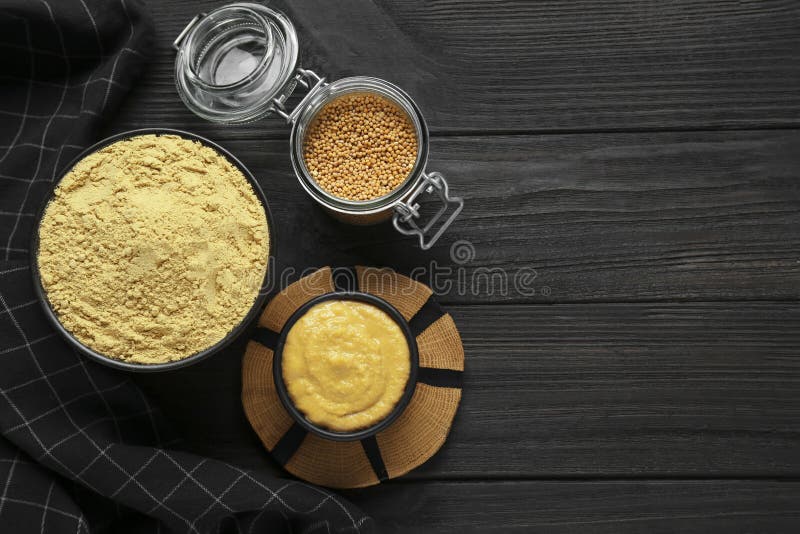 Flat Lay Composition with Aromatic Mustard Powder and Seeds on Black ...