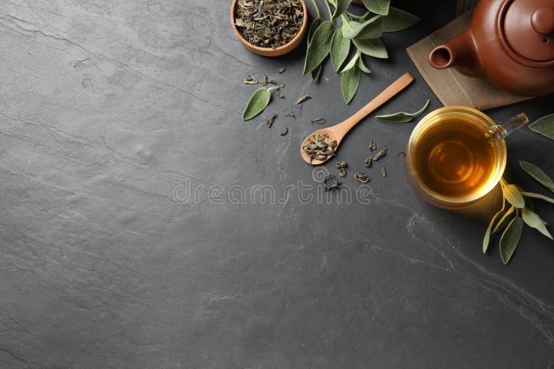 Flat Lay Composition with Aromatic Sage Tea on Black Table. Space for ...
